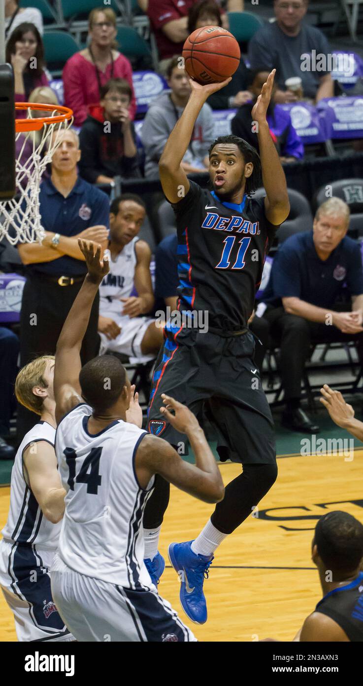 DePaul forward Forrest Robinson (11) takes a jump shot as Loyola ...