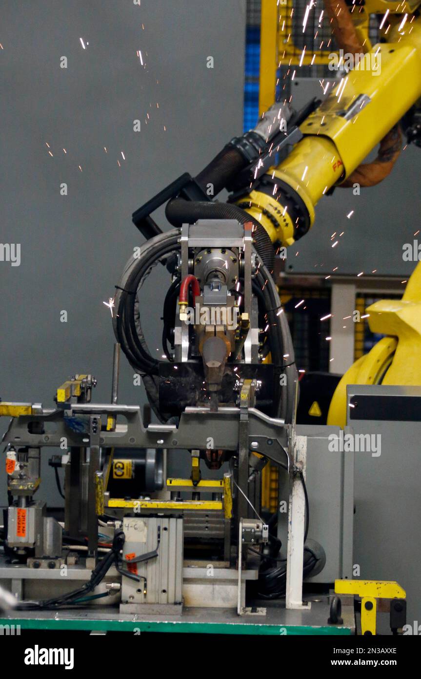 In this Dec. 12, 2014 photograph, sparks fly as a Topre America robot ...