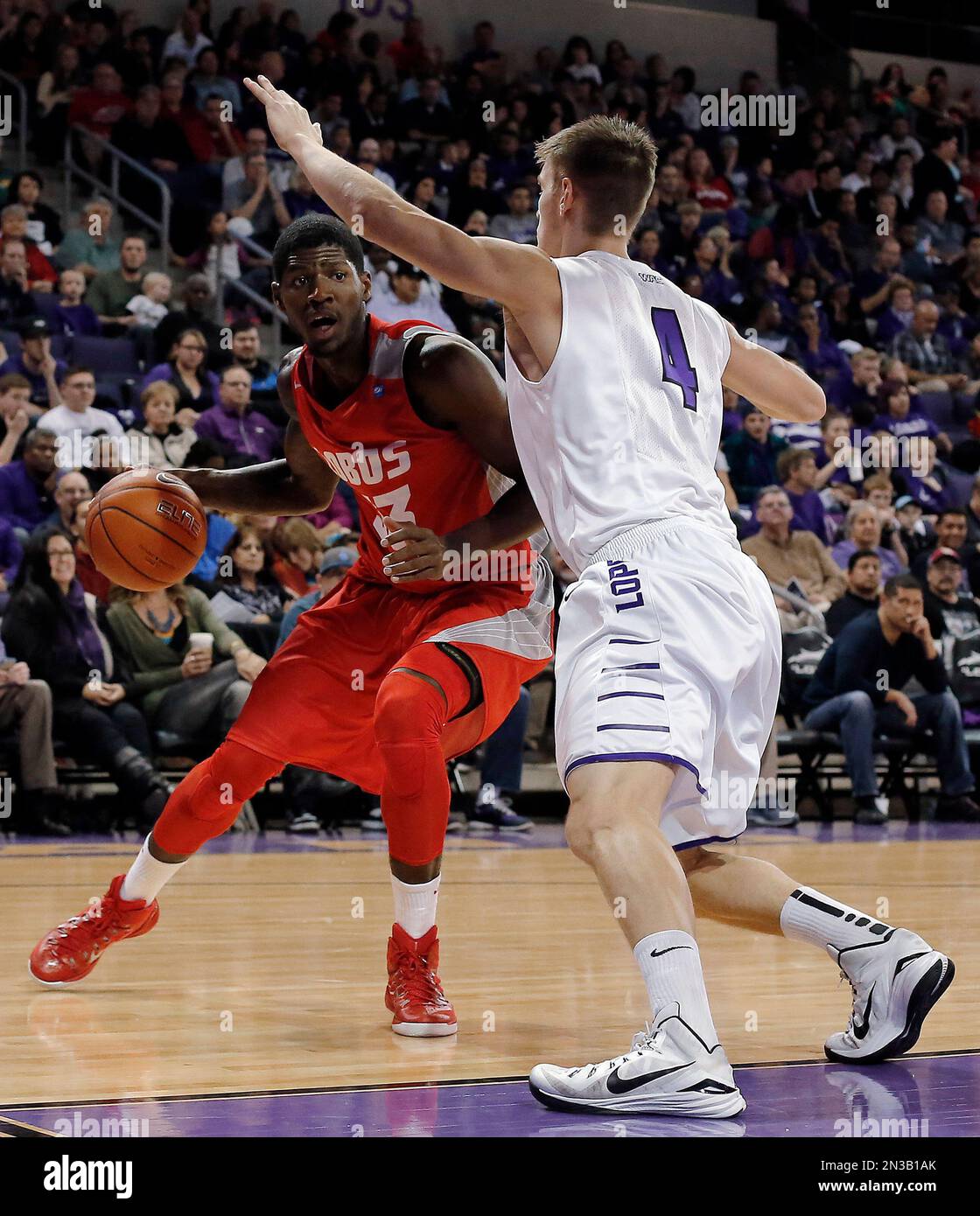 New Mexico guard Deshawn Delaney (33) drives on Grand Canyon guard Ryan ...