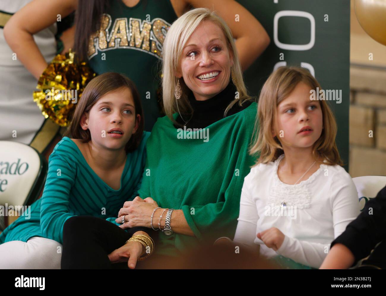 Flanked by her 8-year-old daughter Ava Grace, left, and 7-year-old ...