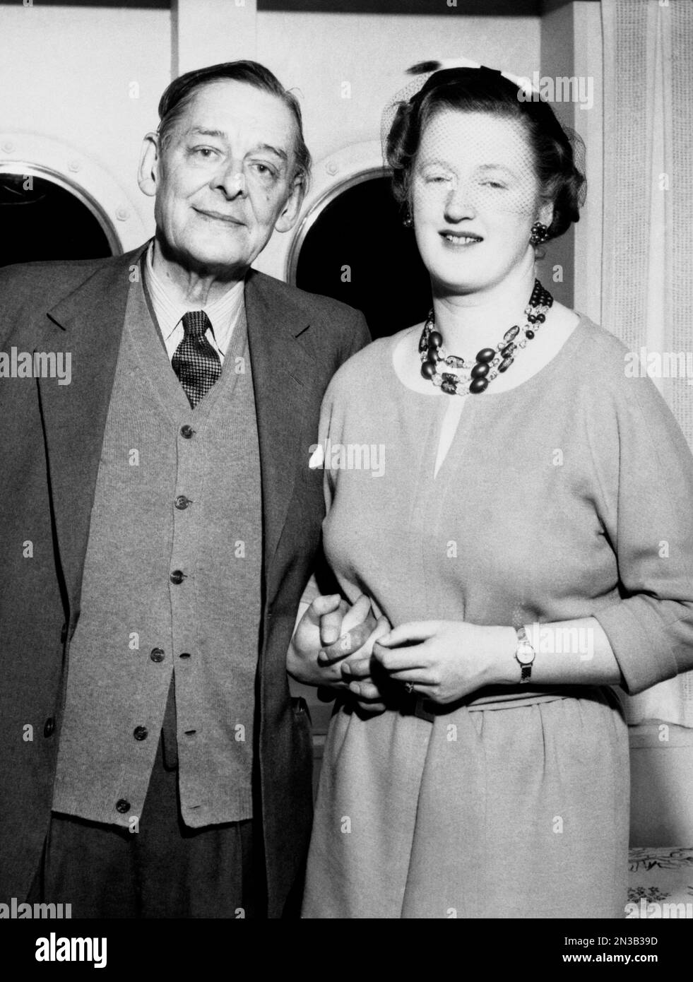 Writer T.S. Eliot and his wife Valerie pose aboard the liner Santa Rosa ...