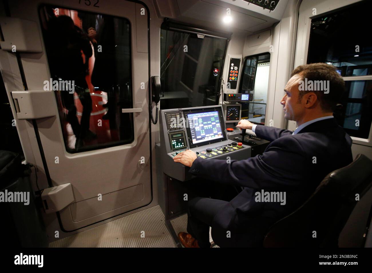A driver in the cockpit of a new subway train of the first line in ...