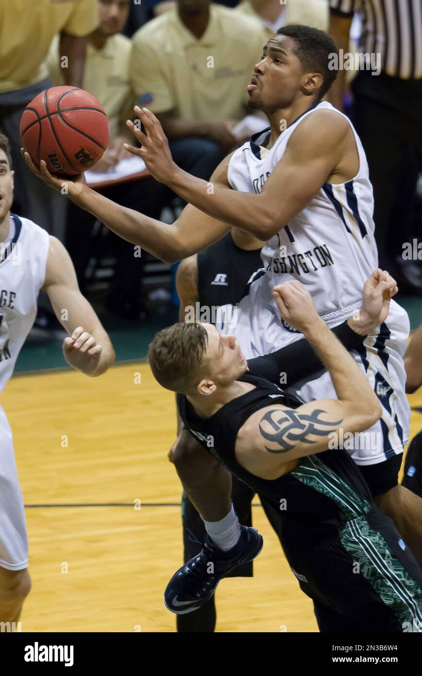 George Washington guard Kethan Savage shoots over Ohio forward Treg ...