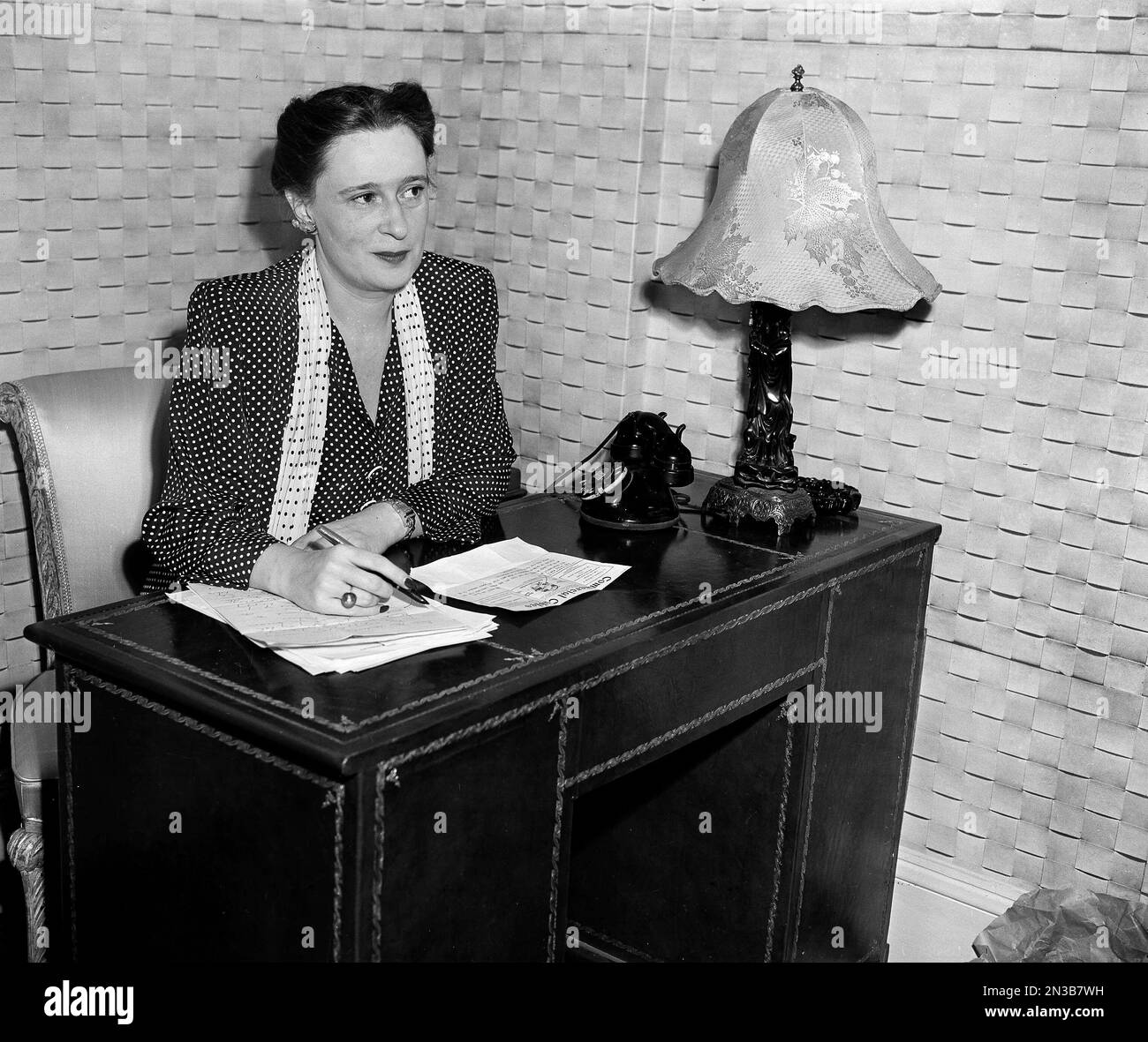 Gloria Morgan Vanderbilt, mother of Gloria Vanderbilt, sits at her desk ...