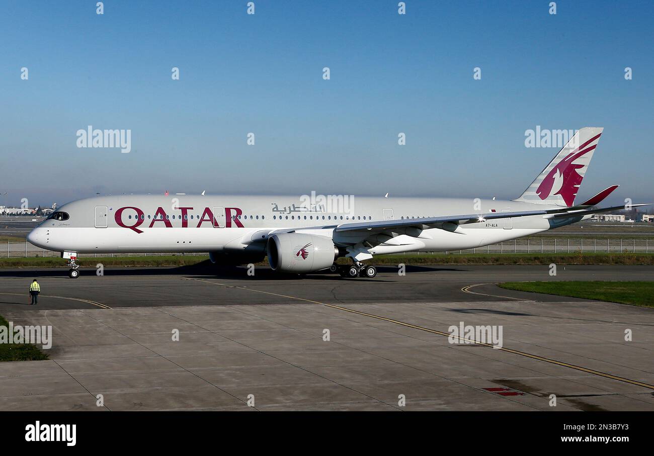 The first Airbus A350 for Qatar Airways sits on the tarmac during the ...