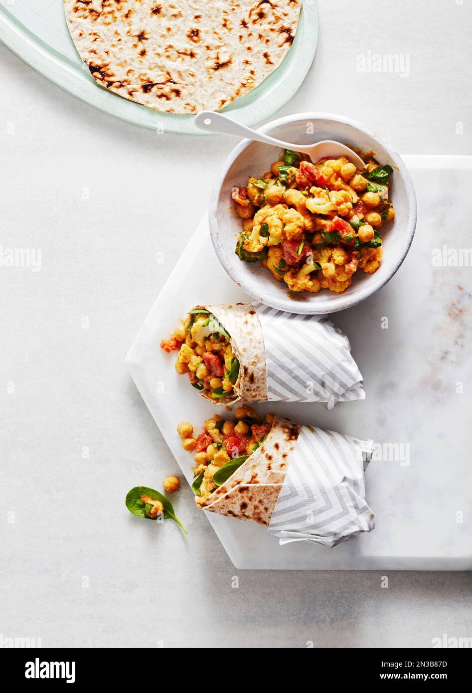 Curried chickpea cauliflower roti wrap Stock Photo - Alamy
