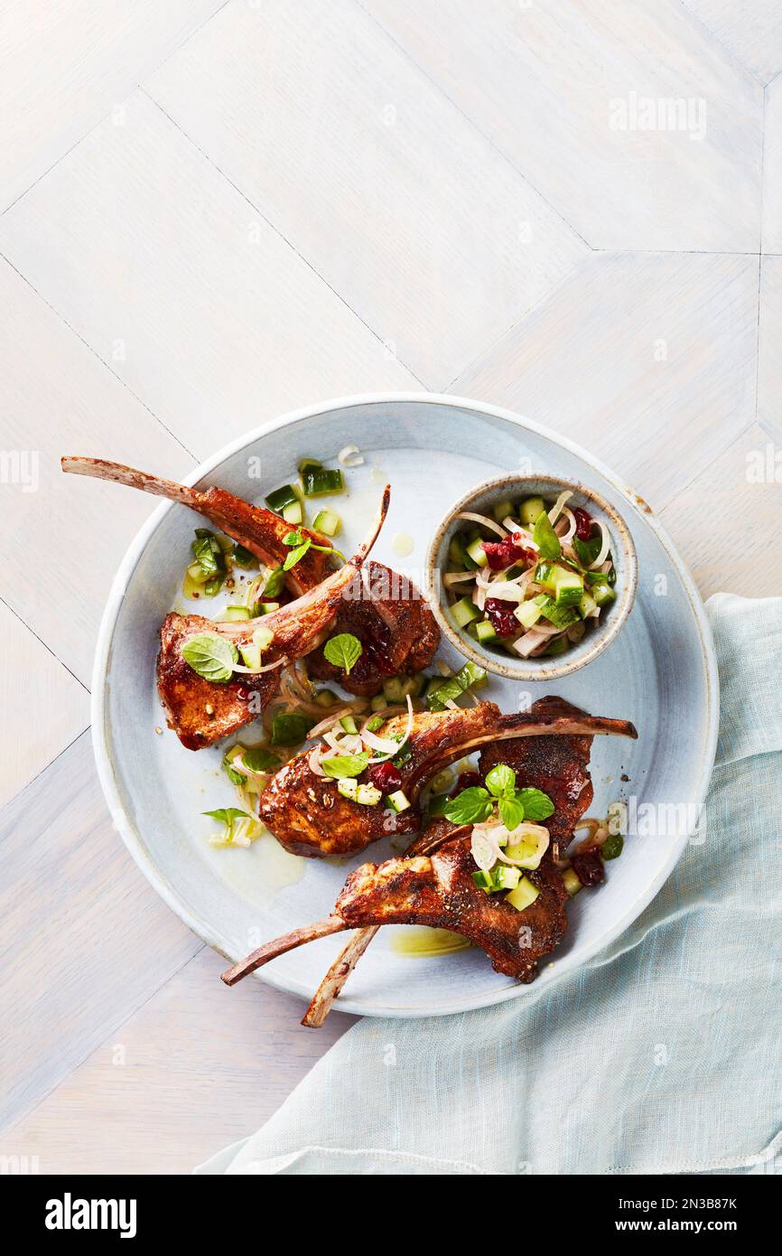 Lamb chops with cucumber mint salsa on serving tray Stock Photo - Alamy