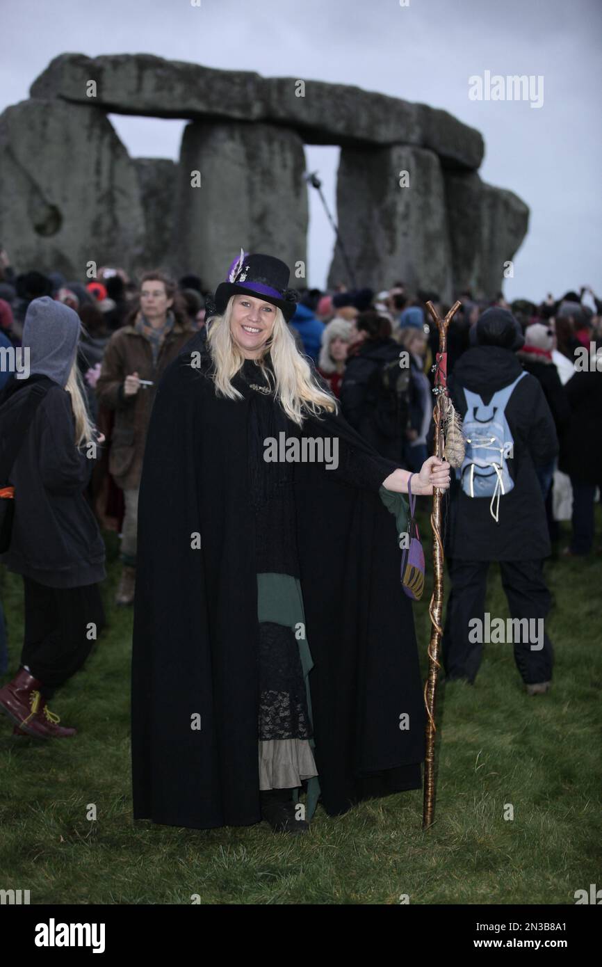 People gather at the historic site of Stonehenge, southwest England to ...