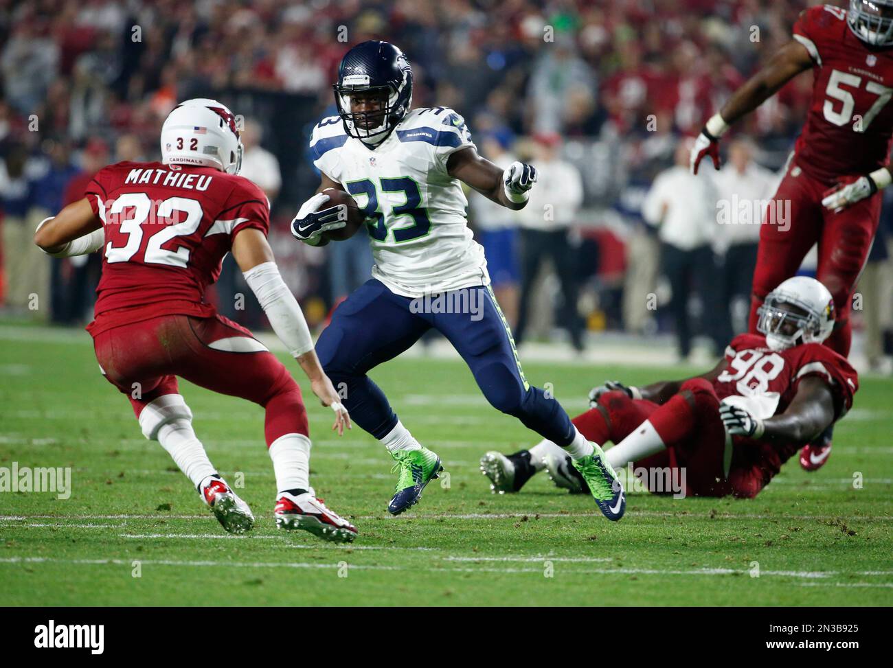 Seattle Seahawks running back Christine Michael (33) tries to avoid ...