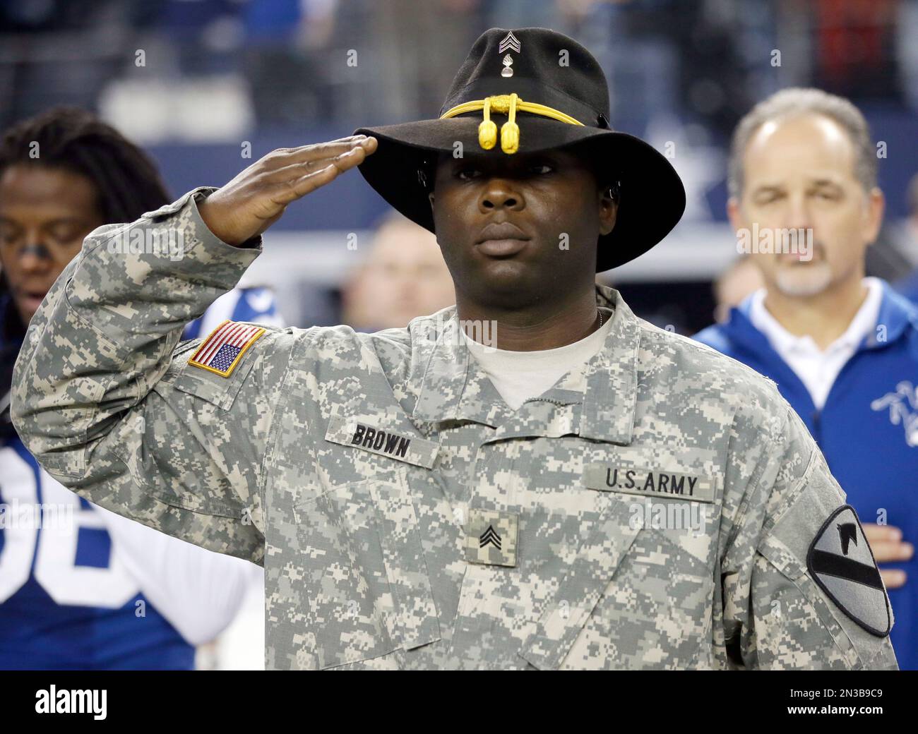 A member of the United States Army salutes during the playing of the ...