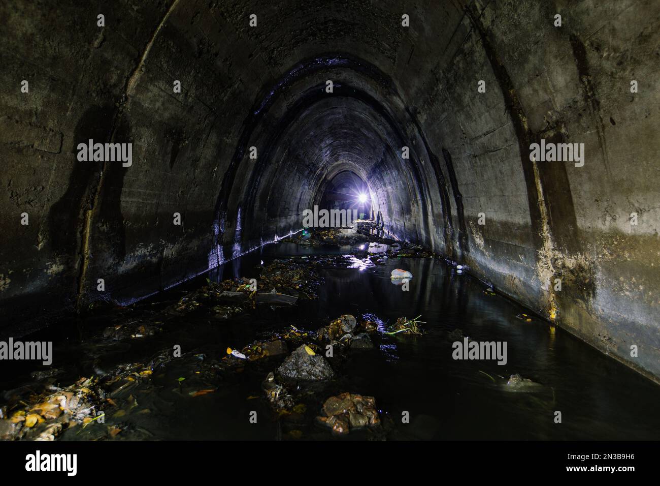 Undergound urban sewer tunnel. Large sewage collector Stock Photo - Alamy