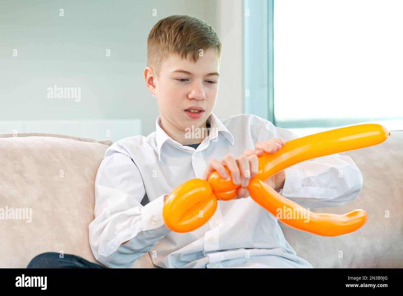 Children inflate modelling balloons. kids having fun with balloons ...