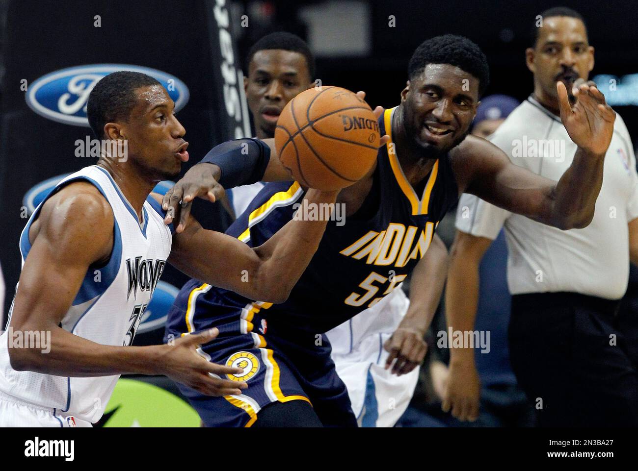 Minnesota Timberwolves forward Thaddeus Young, left, and Indiana Pacers ...