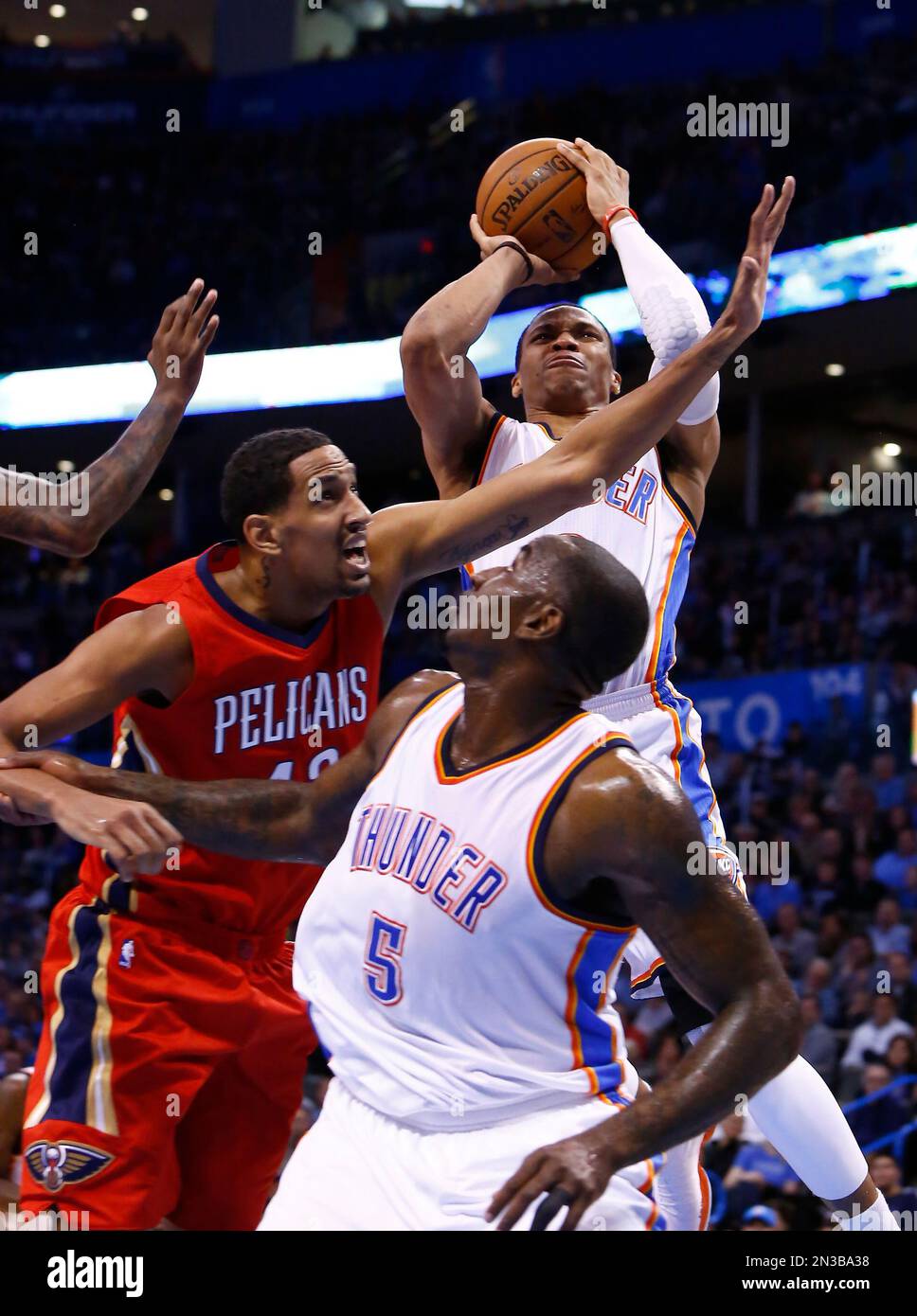 Oklahoma City Thunder guard Russell Westbrook, back, shoots over New ...