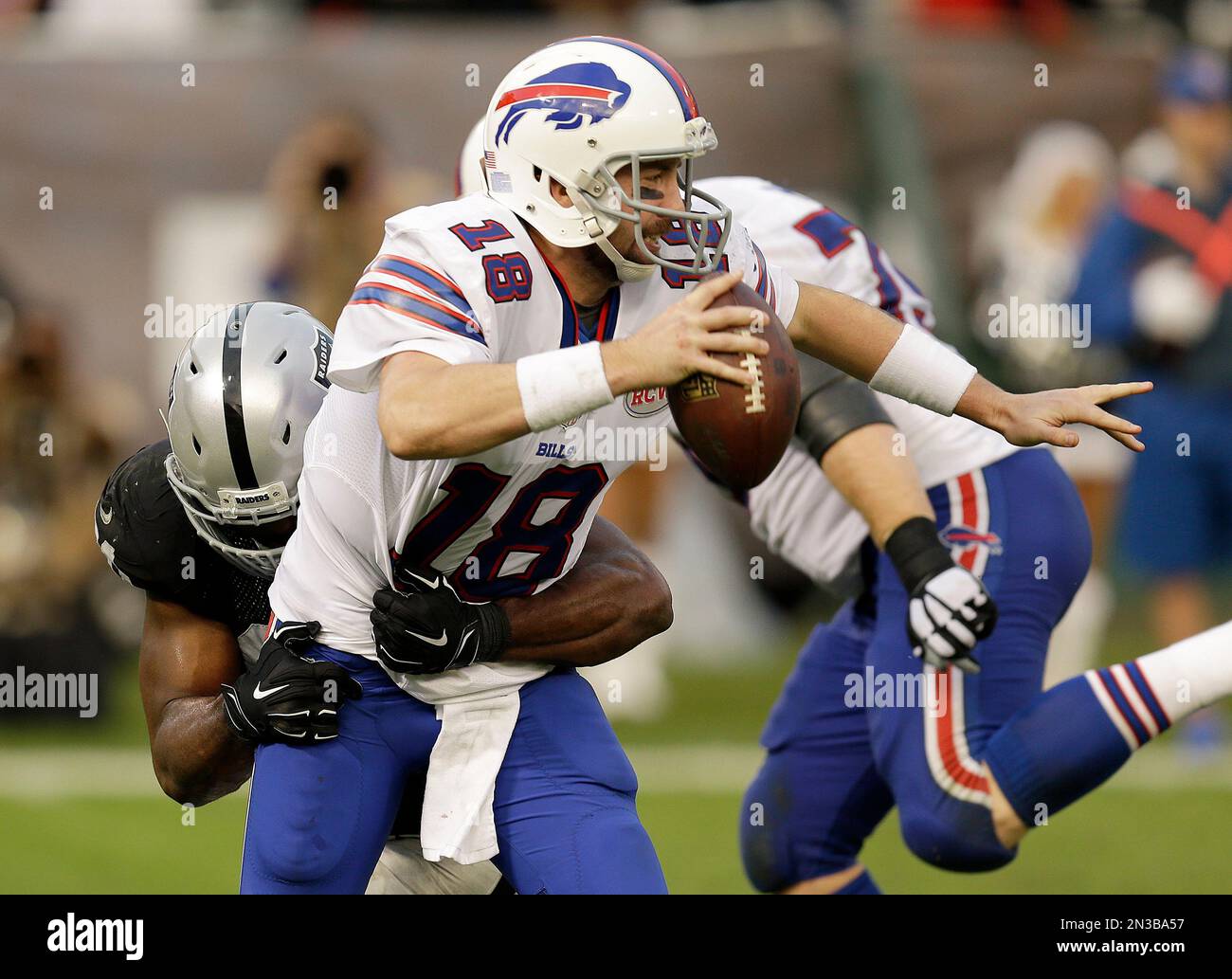 Buffalo Bills quarterback Kyle Orton (18) is sacked by Oakland Raiders ...