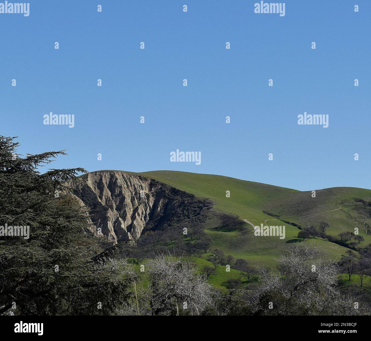 erosion on the green hills in Livermore, California after winter rain ...