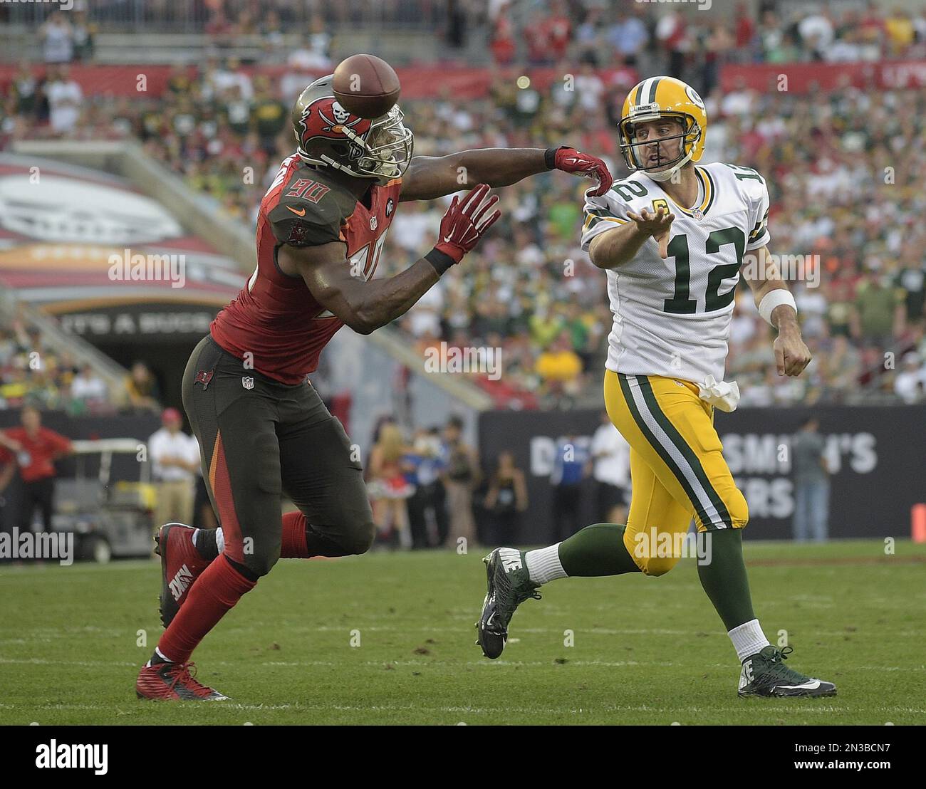 Green Bay Packers quarterback Aaron Rodgers (12) flips the ball past ...