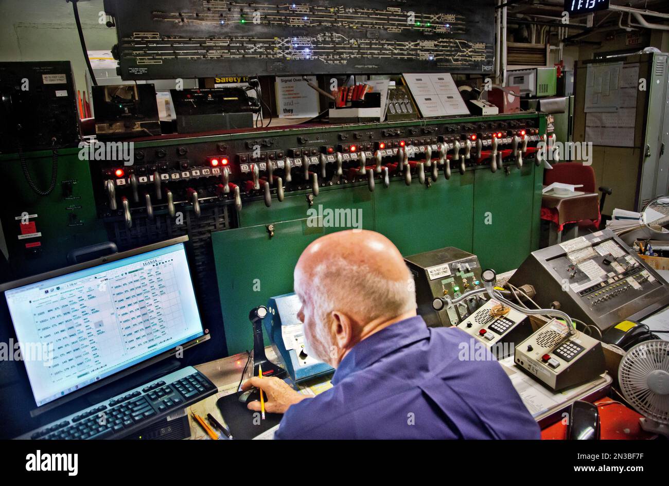 In this Dec. 16, 2014 photo, MTA subway train dispatcher Joe Maher work ...