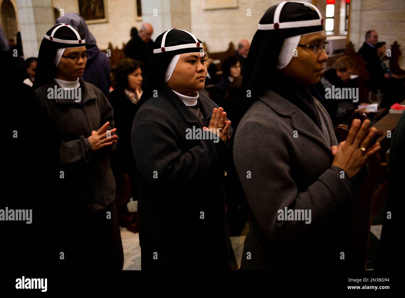 Nuns pray during the last Sunday Mass before Christmas in the Church of ...