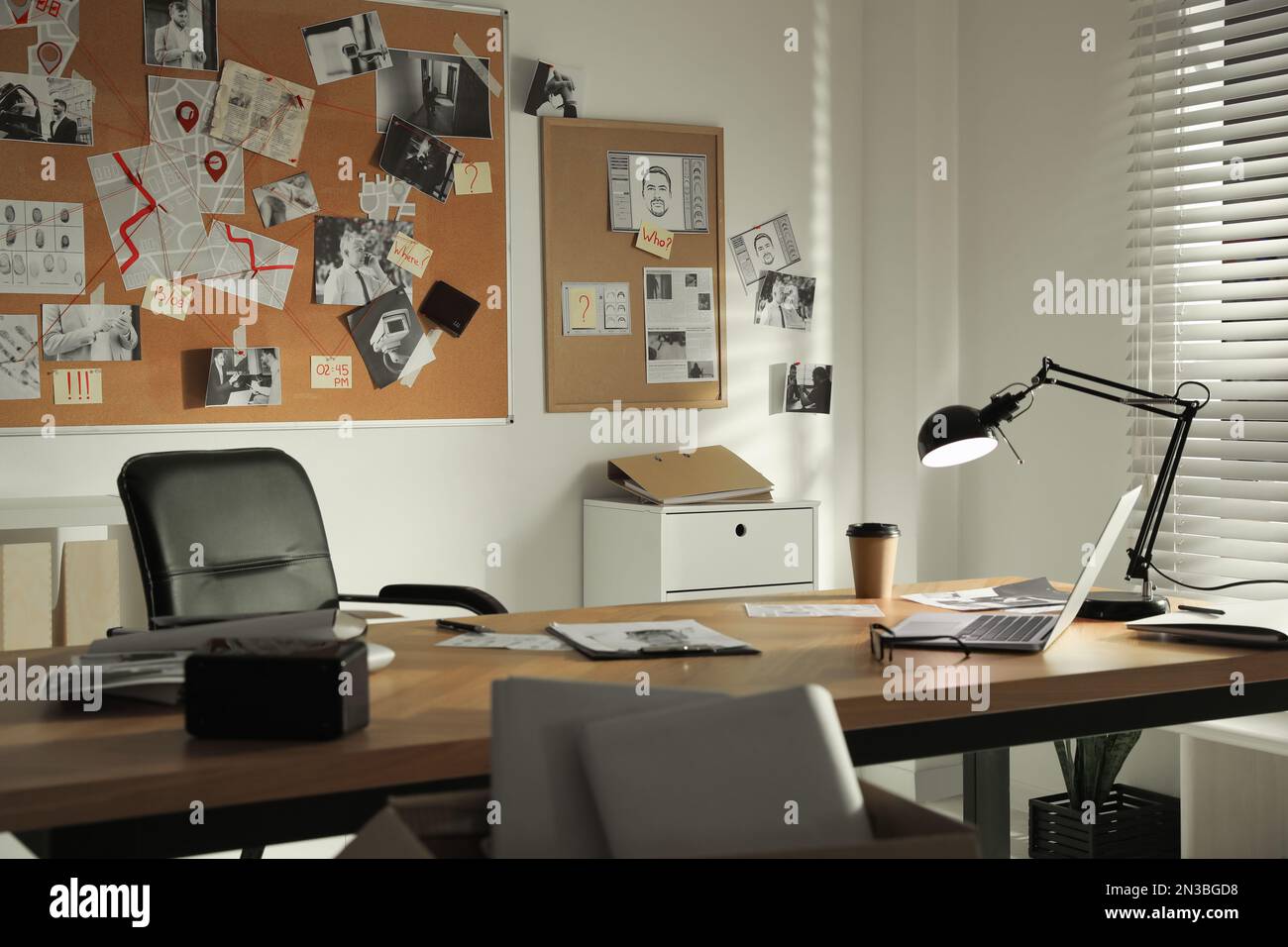 Detective office interior with big wooden desk and evidence board Stock ...