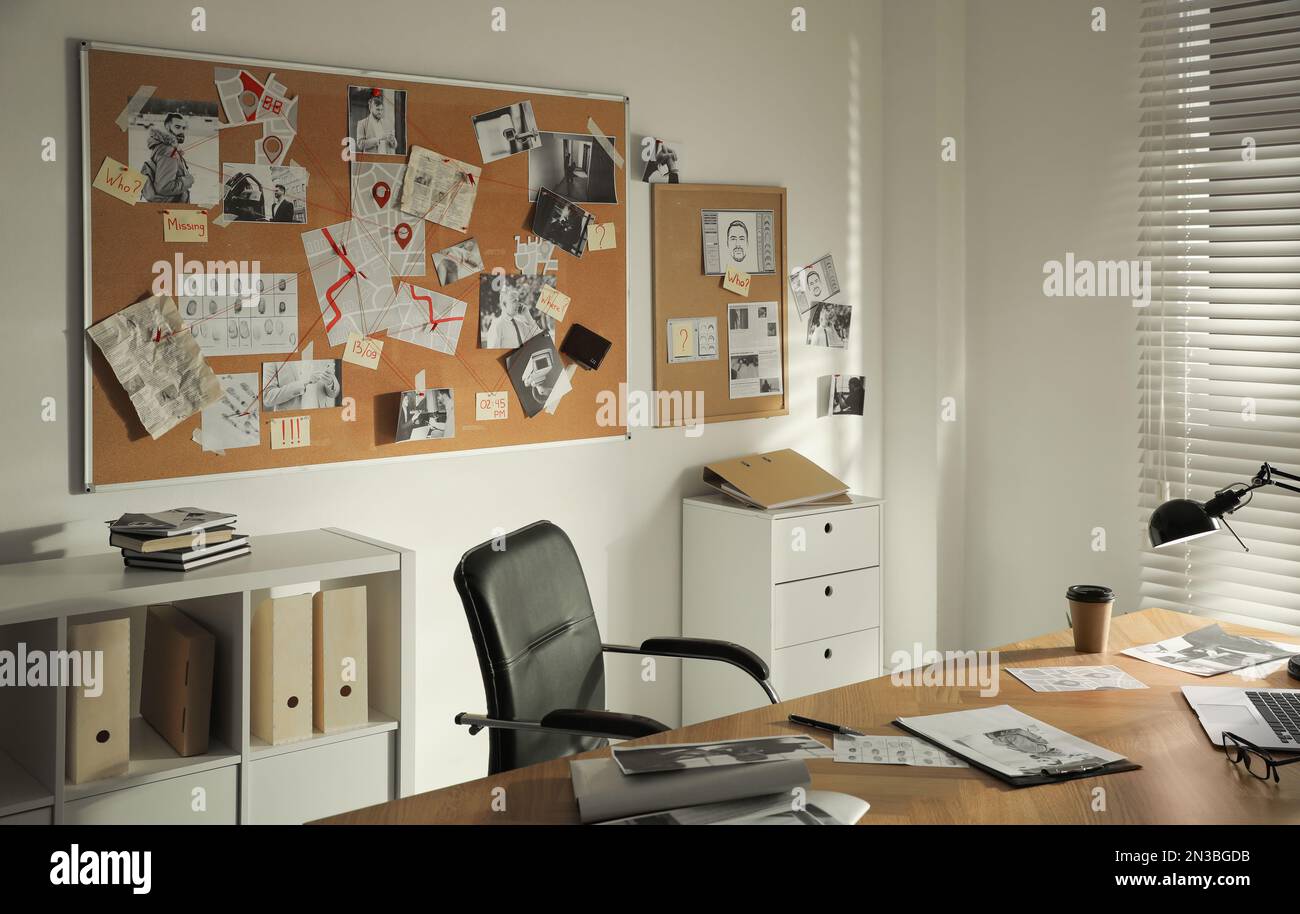 Detective office interior with big wooden desk and evidence board Stock ...