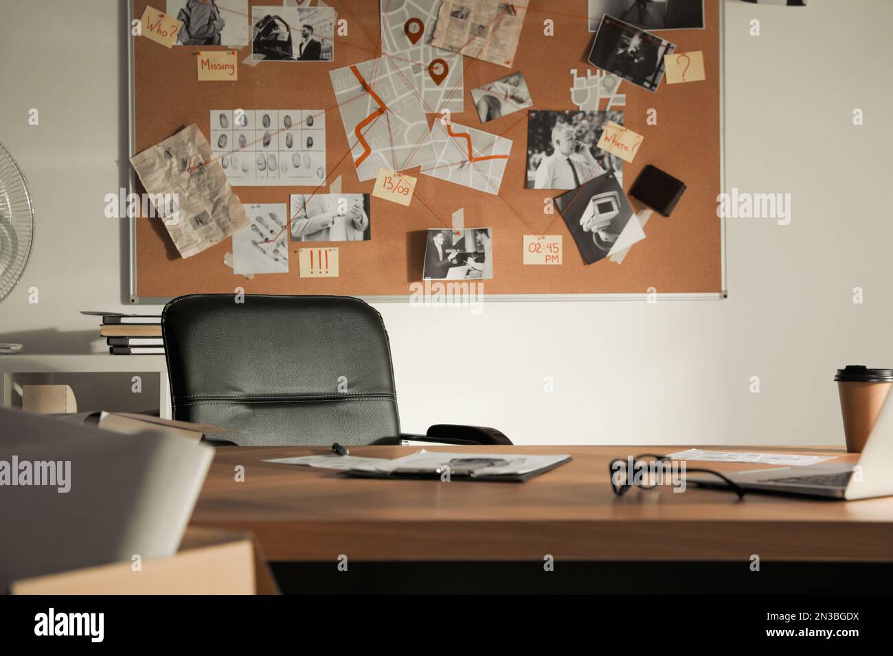 Detective office interior with big wooden desk and evidence board Stock ...