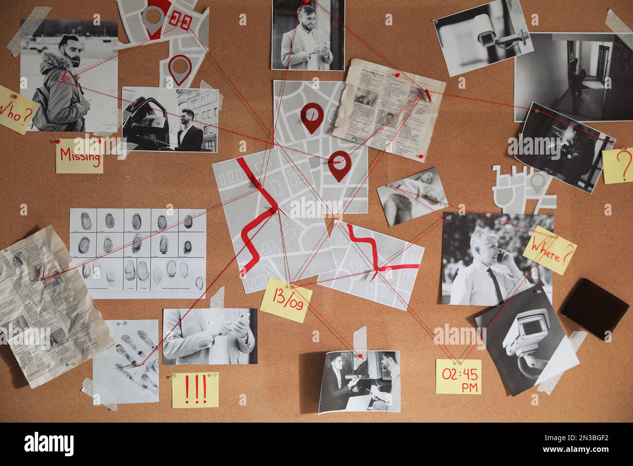 Detective board with crime scene photos and red threads, closeup Stock ...