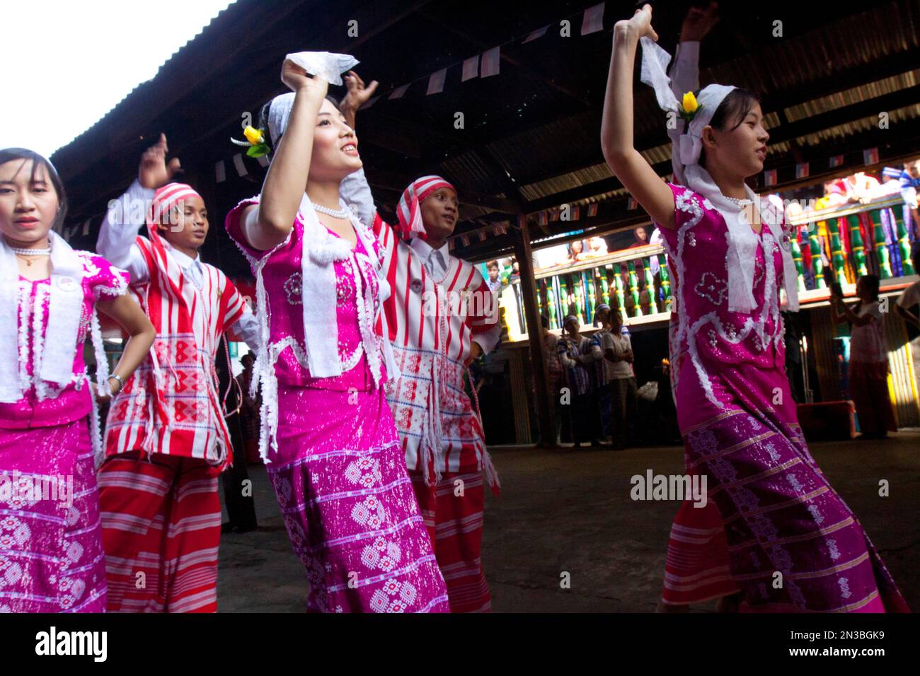 Clad in traditional attire, ethnic Karen artists perform their ...