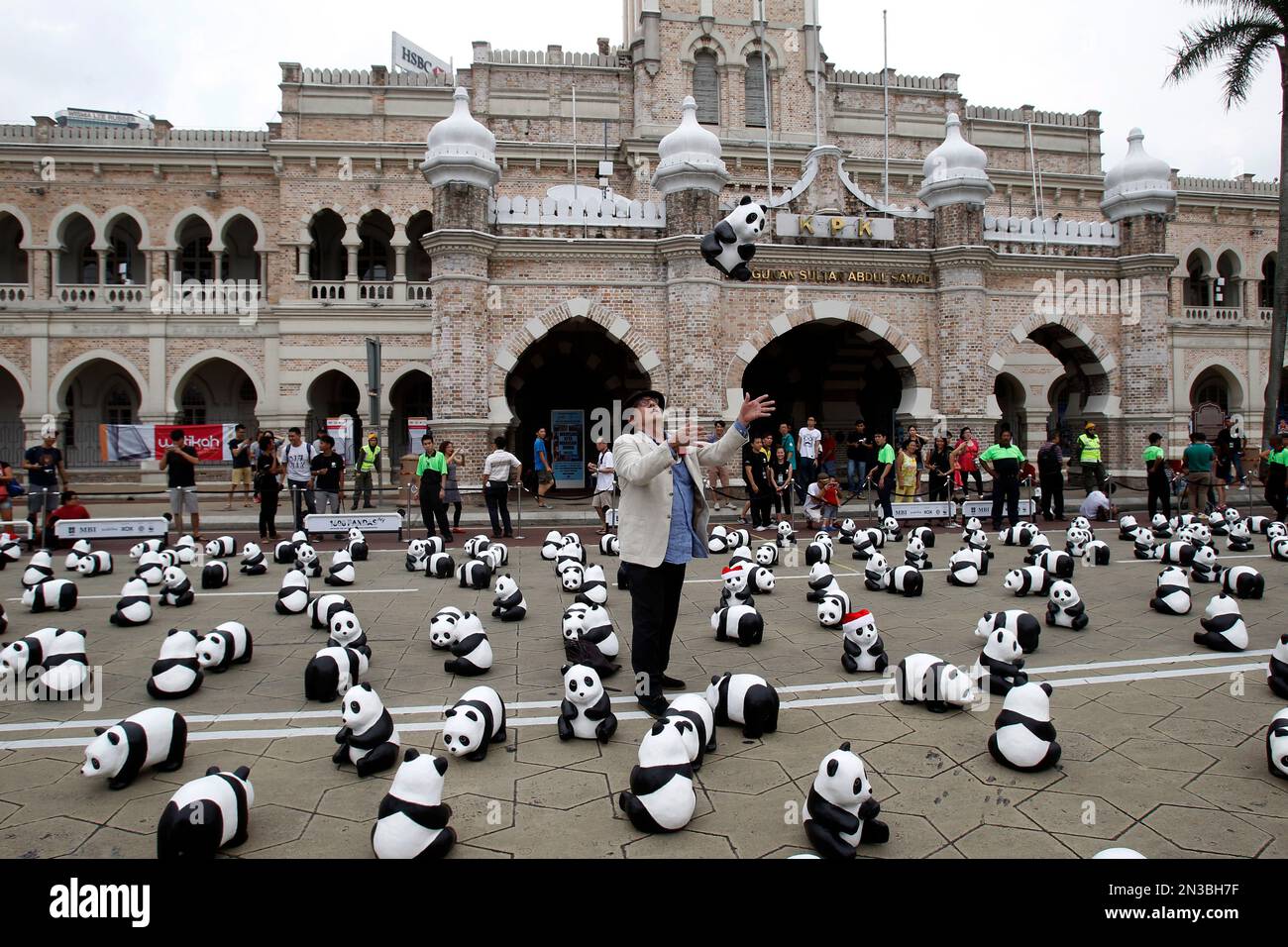 French artist Paulo Grangeon poses with part of the 1,600 paper pandas ...