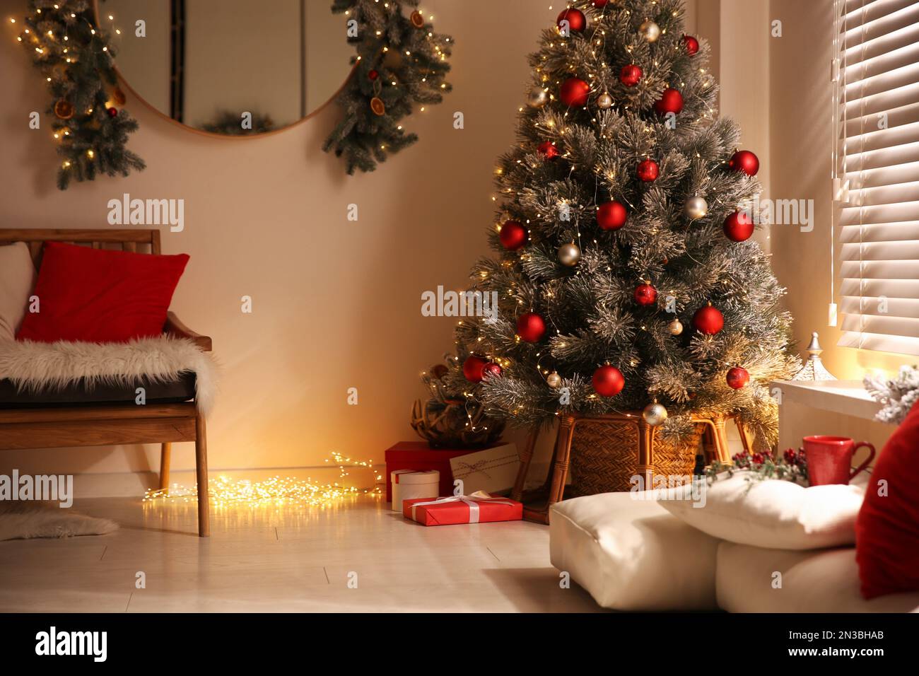 Beautiful decorated Christmas tree in festive room interior Stock Photo ...