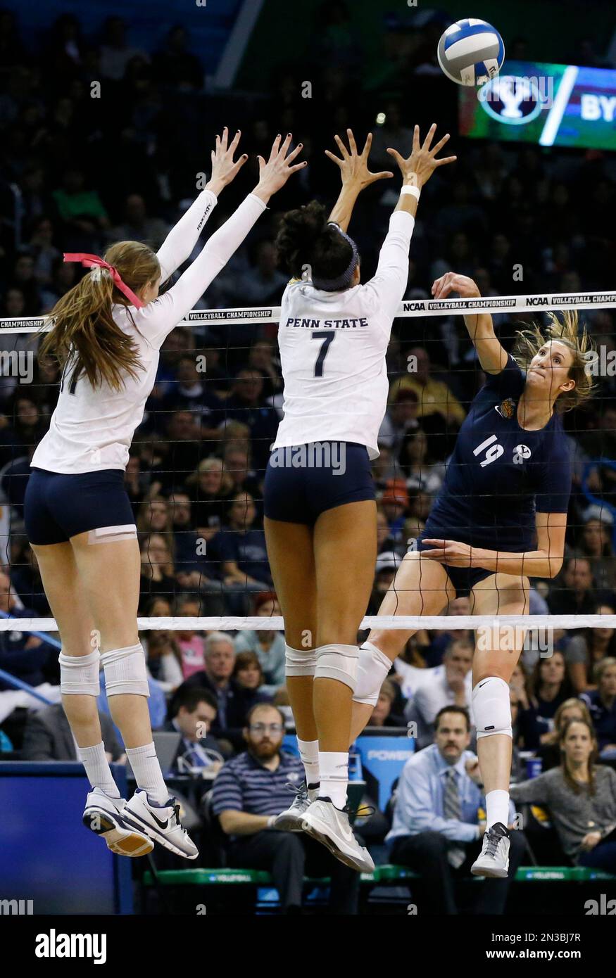 BYU's Jennifer Hamson (19) hits over Penn State's Megan Courtney (17 ...
