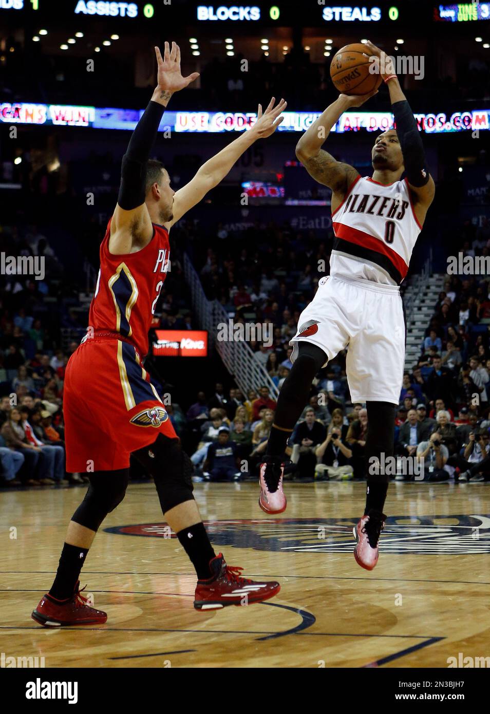 Portland Trail Blazers guard Damian Lillard (0) shoots over New Orleans ...