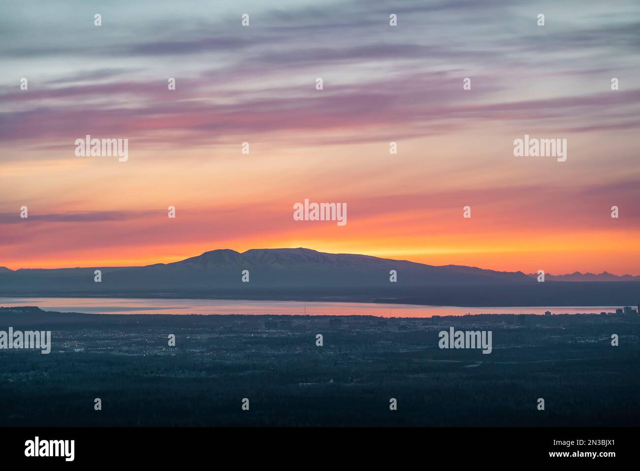 The sun sets above Mt. Susitna, or Sleeping Lady, across Cook Inlet ...