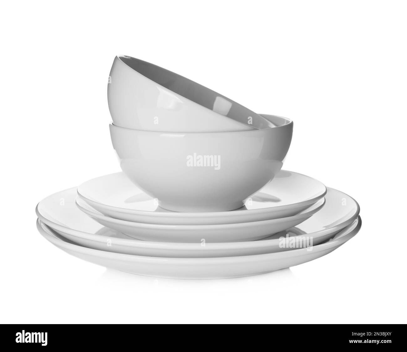 Stack of clean dishware isolated on white Stock Photo - Alamy