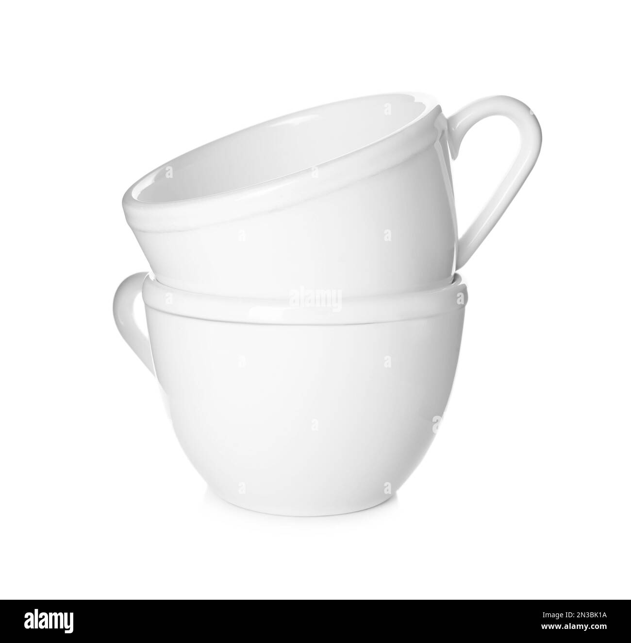 Clean empty ceramic cups isolated on white Stock Photo - Alamy