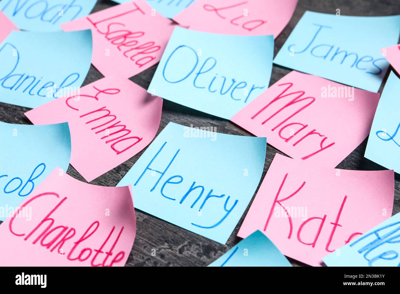 Paper notes with different baby names on grey background Stock Photo ...