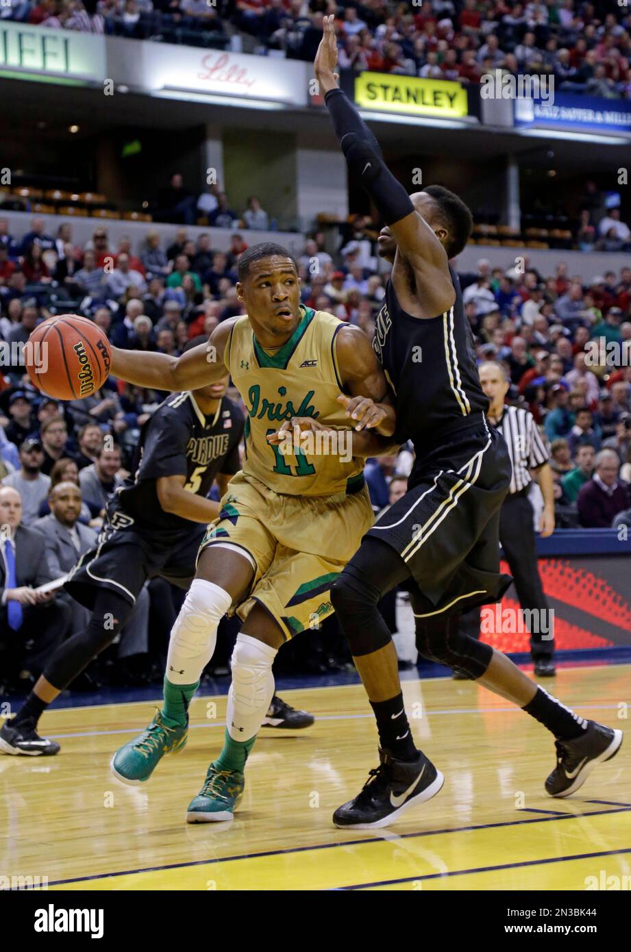 Notre Dame guard Demetrius Jackson (11) drives under Purdue guard Jon ...
