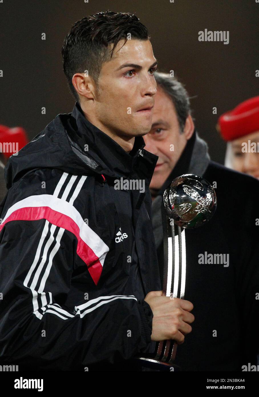 Real Madridâ€™s Cristiano Ronaldo, holding the trophy, walks past UEFA ...
