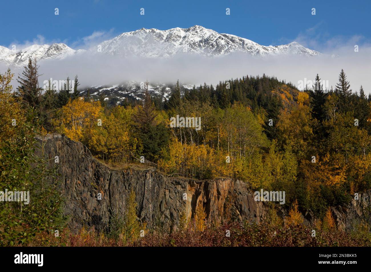 Fall colors on a sunny day with a blue sky along the Seward Highway ...