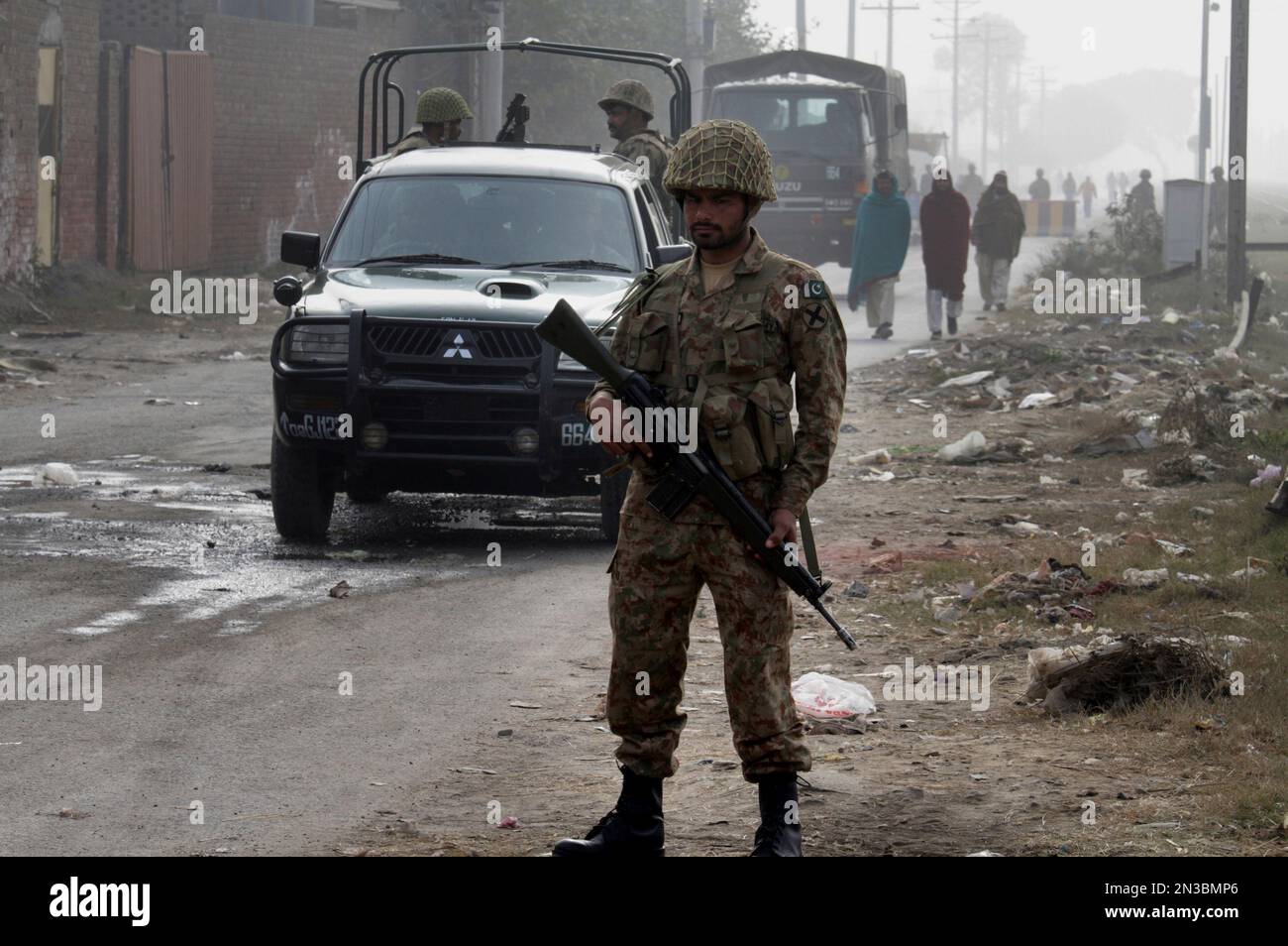 Pakistan army troops patrol on a road leading to the central prison on ...