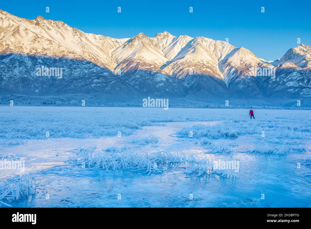 A caucasian woman backcountry ice skating, nordic blading on Gull Lake ...