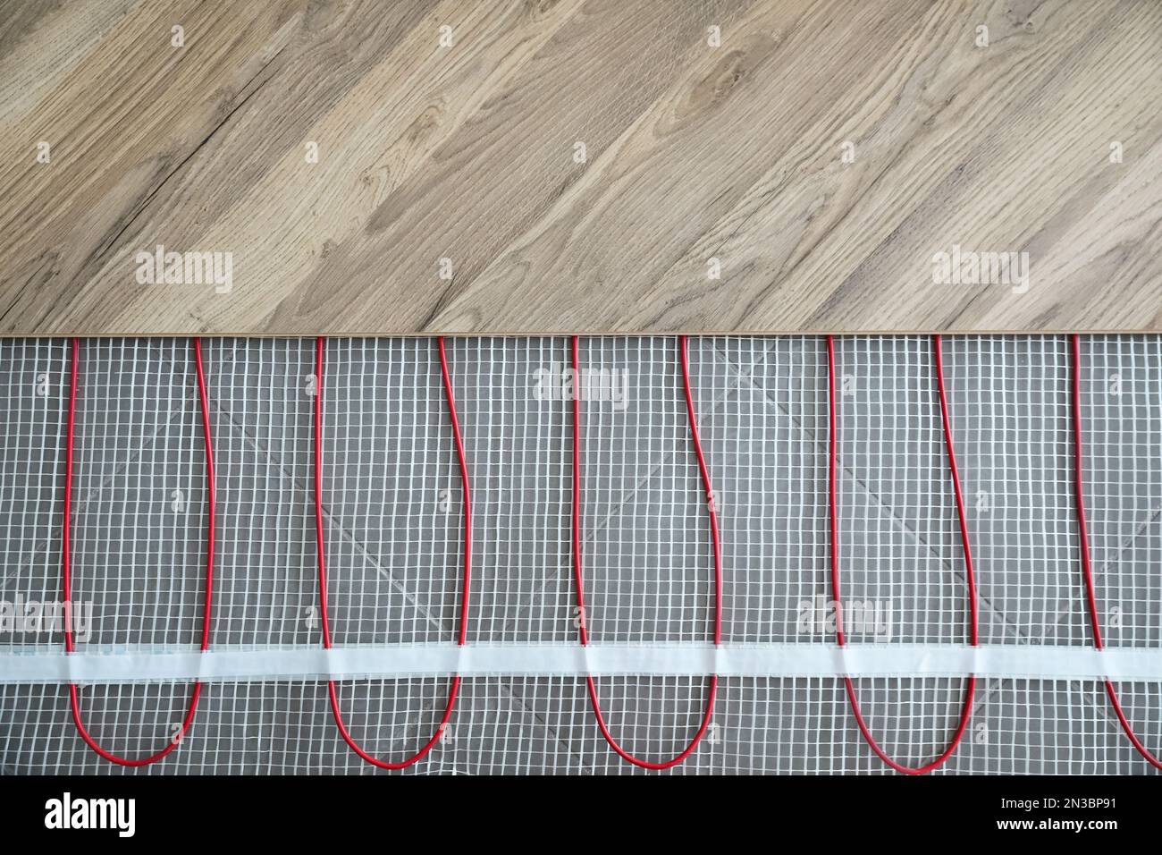 Installation of modern underfloor trace heating system indoors, top ...