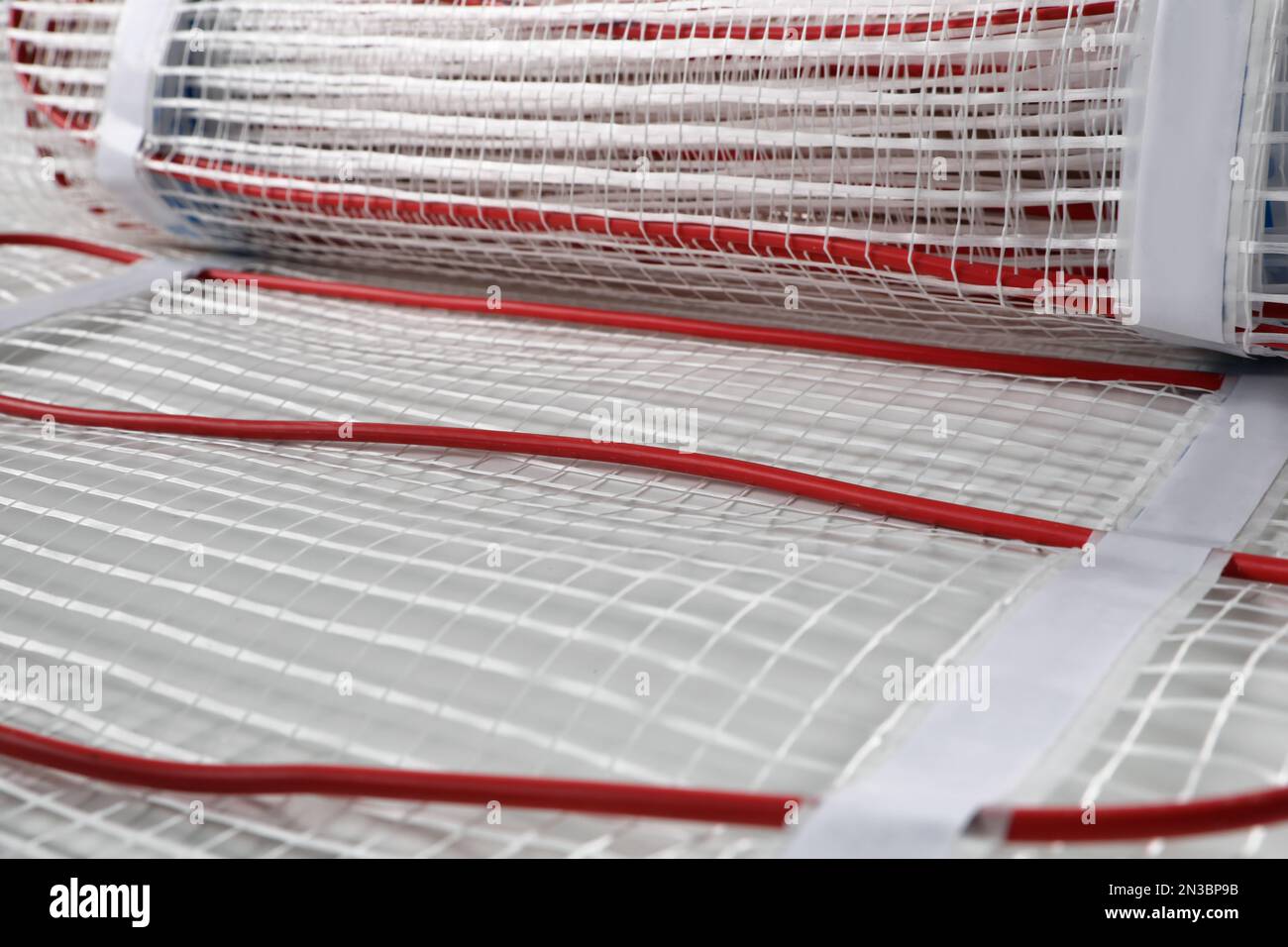 Installation of modern underfloor trace heating system indoors, closeup ...