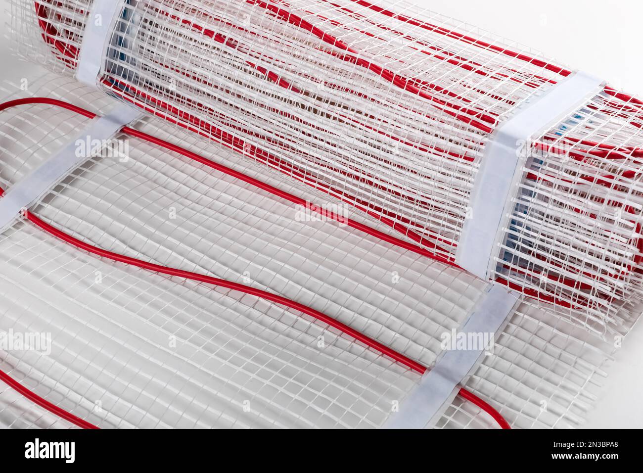 Installation of modern underfloor trace heating system indoors, closeup ...