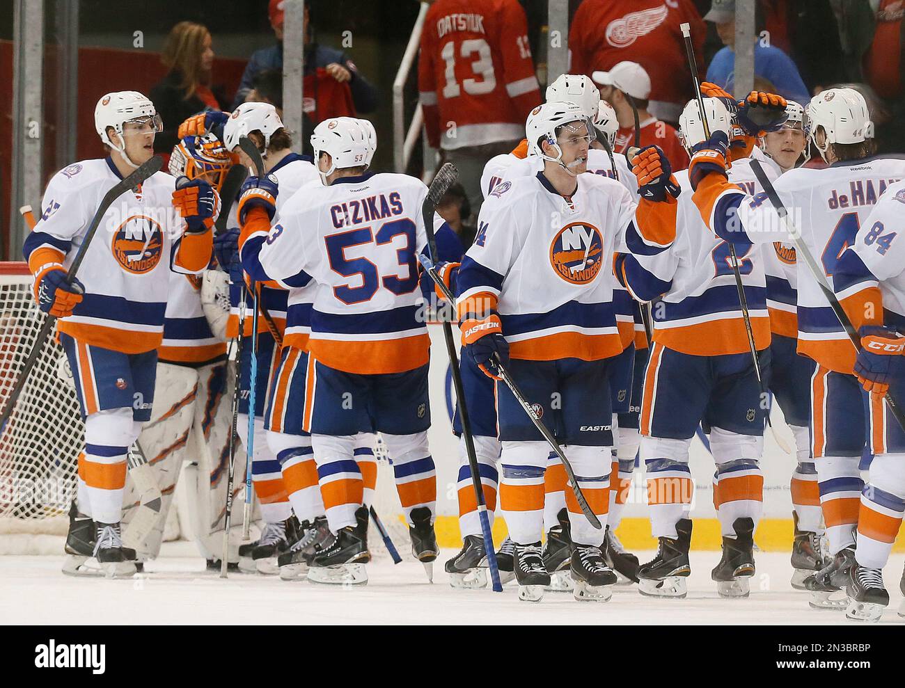 New York Islanders players celebrate their 2-1 win over the Detroit Red ...