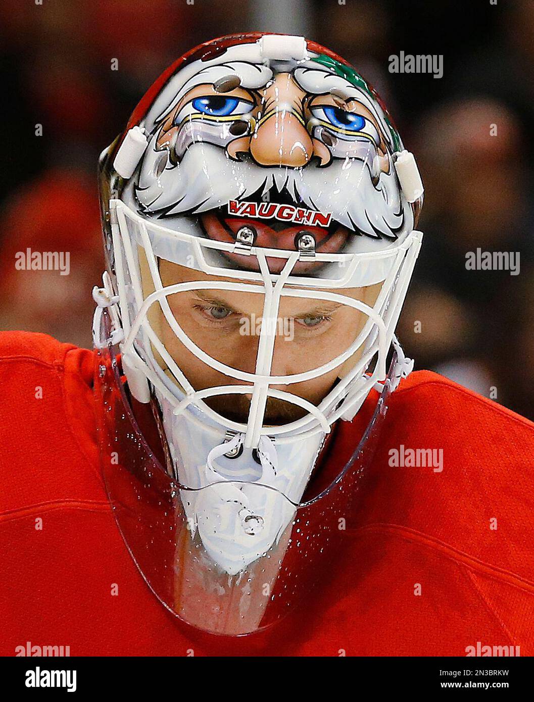 Detroit Red Wings goalie Jimmy Howard (35) wears a helmet with Santa ...