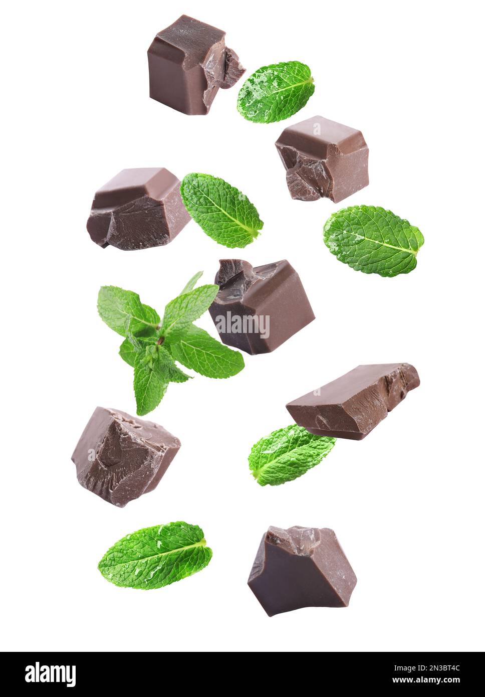 Milk chocolate pieces and mint falling on white background Stock Photo ...