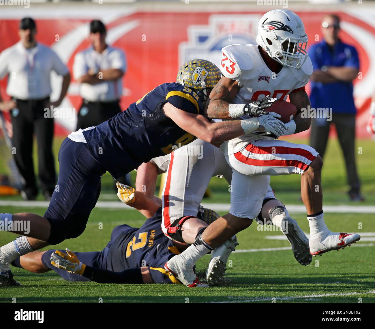Southern Oregon running back Melvin Mason (23) breaks away from Marian ...