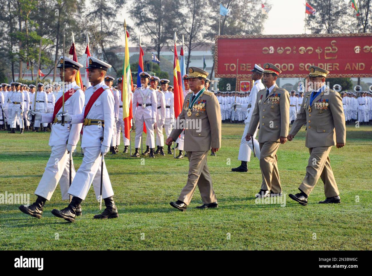 Senior General Min Aung Hlaing, center, inspects parade soldiers during ...