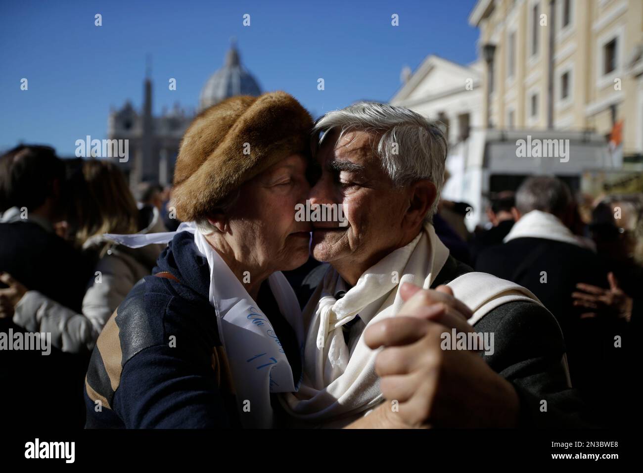 A couple dances tango in front of St. Peter's Square to celebrate Pope ...